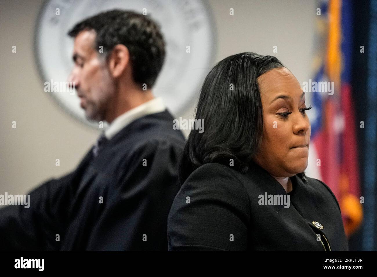FILE - Fulton County District Attorney Fani Willis, right, and Fulton ...
