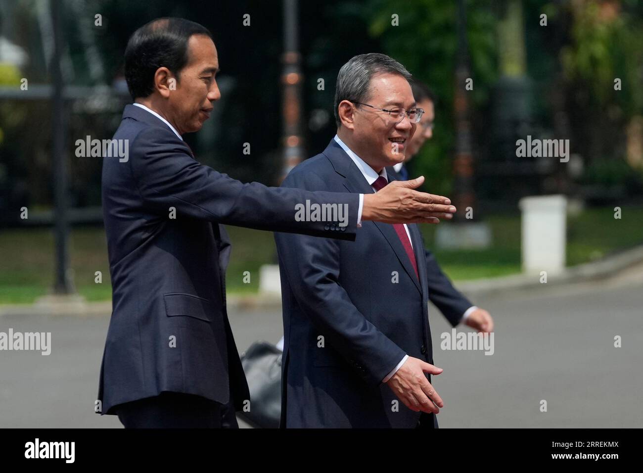 Indonesian President Joko Widodo, left, shows the way to Chinese ...