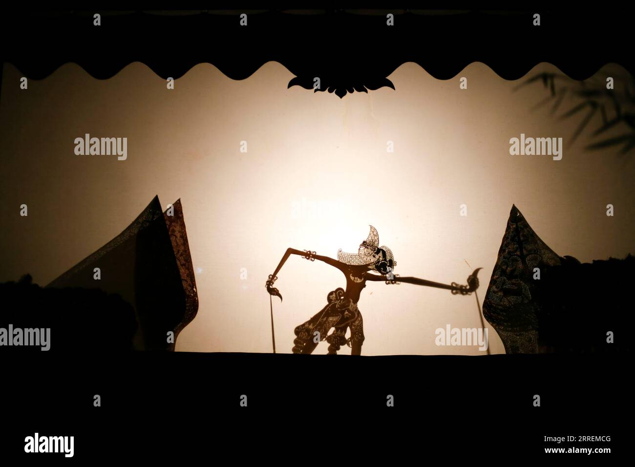 A scene in a shadow puppet show or wayang kulit Stock Photo - Alamy