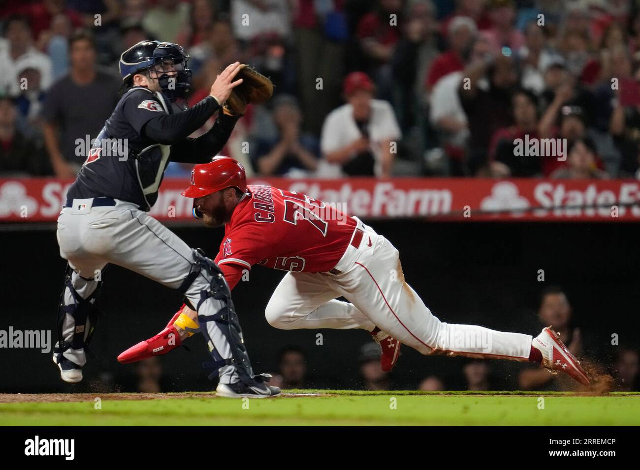 Los Angeles Angels' Trey Cabbage (75) scores off of a single hit by ...