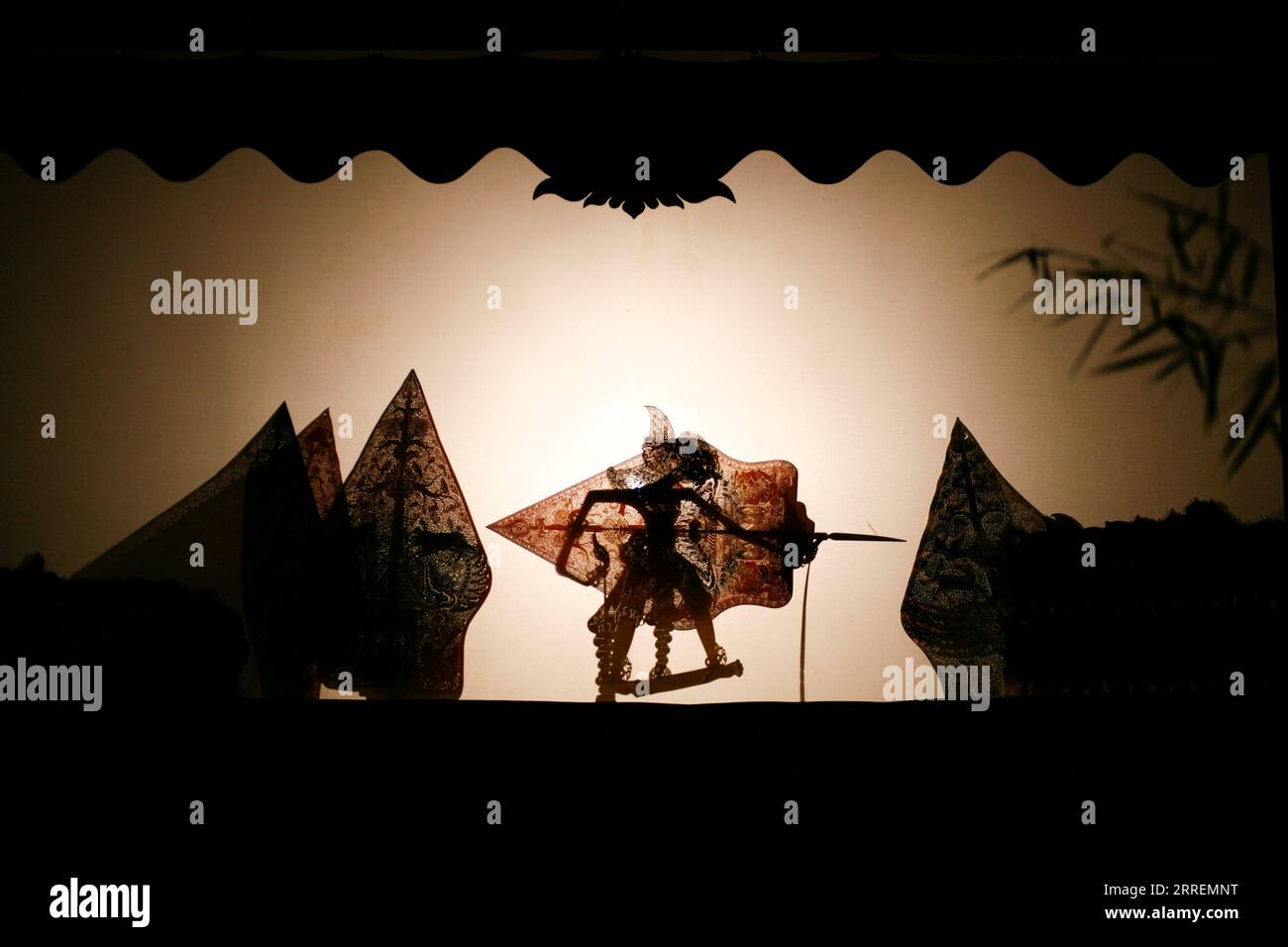 A scene in a shadow puppet show or wayang kulit in the screen Stock ...