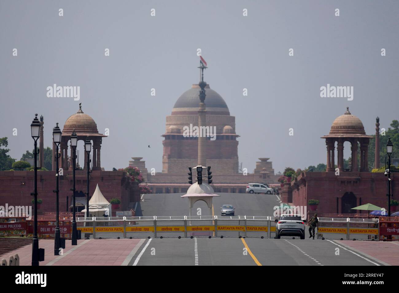 A security person checks a vehicle outside the Indian Presidential ...