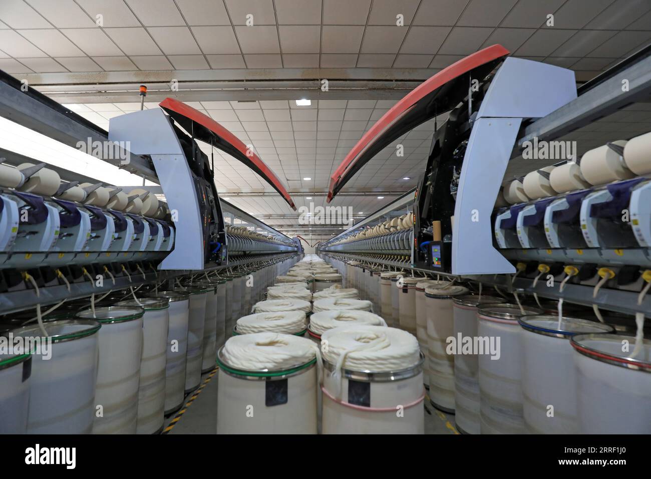 Machinery and equipment of spinning mill Stock Photo - Alamy