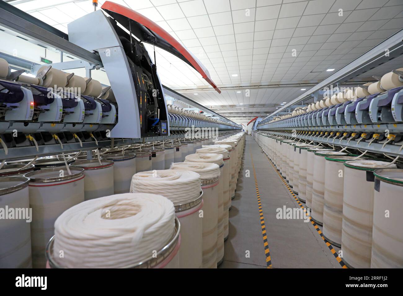 Machinery and equipment of spinning mill Stock Photo - Alamy