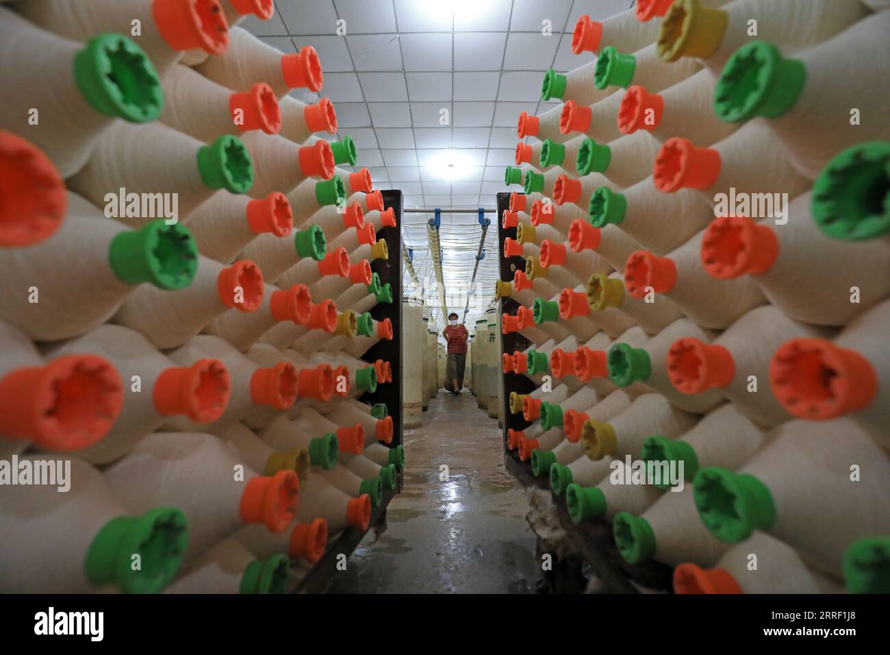 cotton yarn in the workshop of spinning mill Stock Photo - Alamy