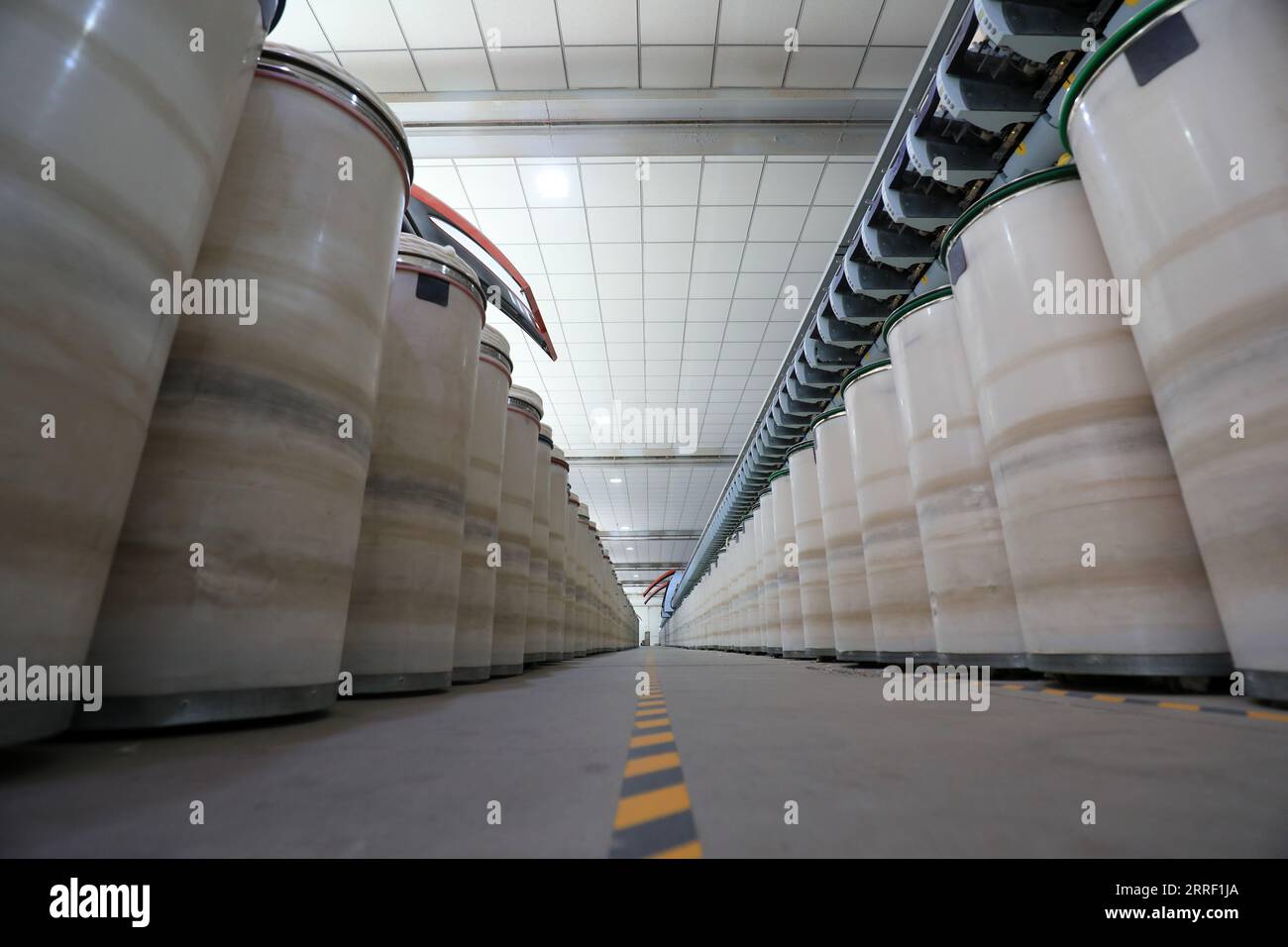 Machinery and equipment of spinning mill Stock Photo - Alamy