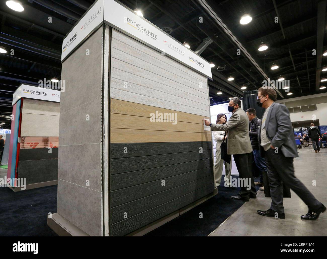 220323 -- VANCOUVER, March 23, 2022 -- People look at wall construction ...