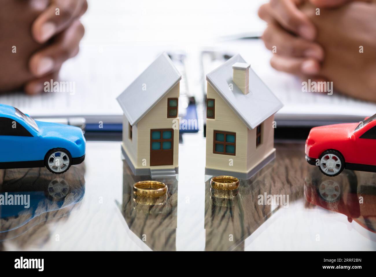 Wife And Husband Splitting House And Car During Divorce Process Stock ...