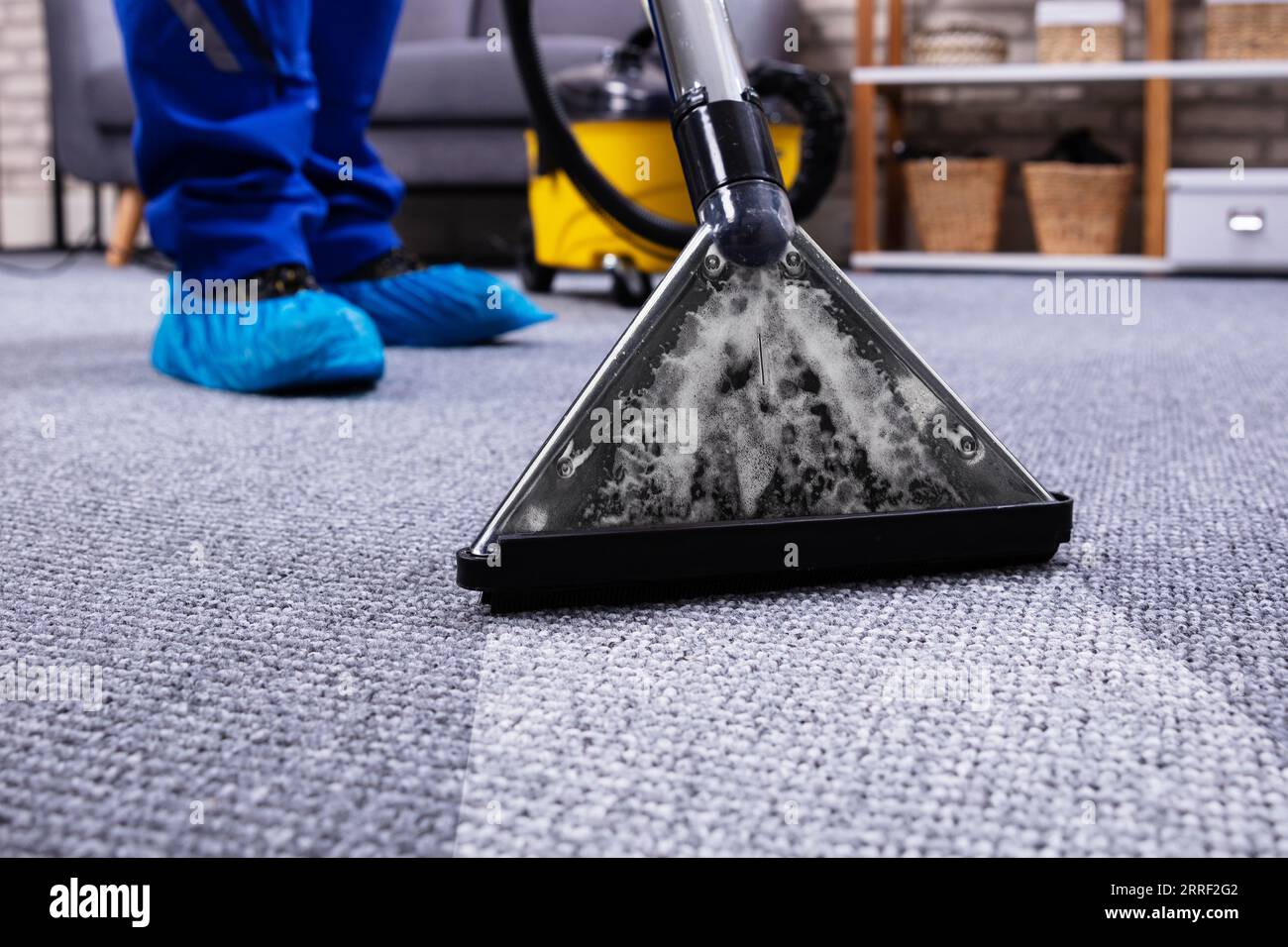 Human Cleaning Carpet In The Living Room Using Vacuum Cleaner At Home ...