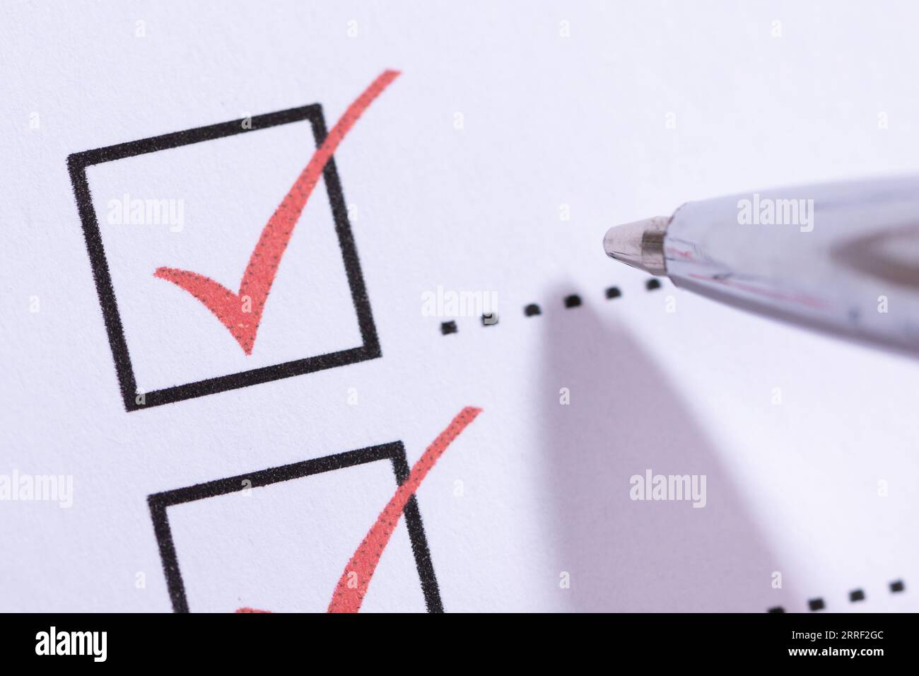 Close-up Of Person's Hand Marking On Checklist With Pen Stock Photo - Alamy