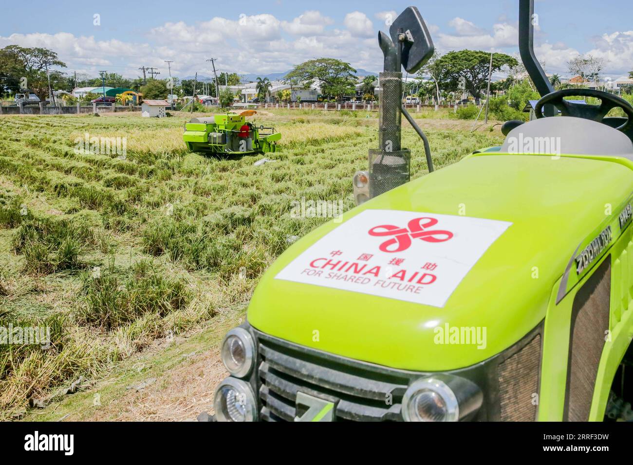 220326 -- NUEVA ECIJA, March 26, 2022 -- A farmer works at the ...