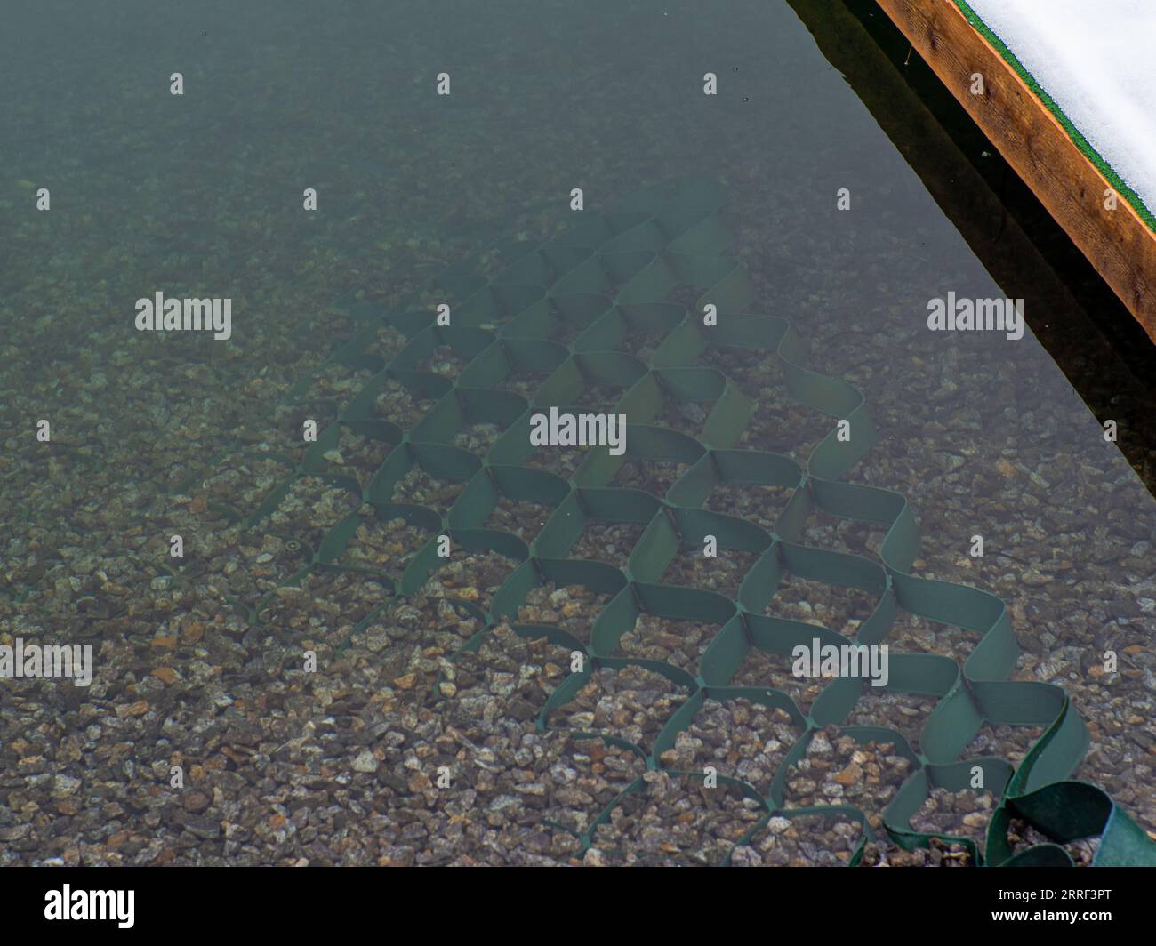 Green polymer geogrid to strengthen the river bank Stock Photo - Alamy