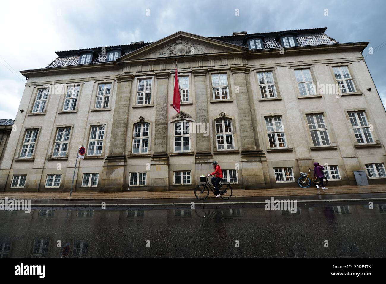 Cycling on Bredgade on a rainy day. Copenhagen, Denmark Stock Photo - Alamy