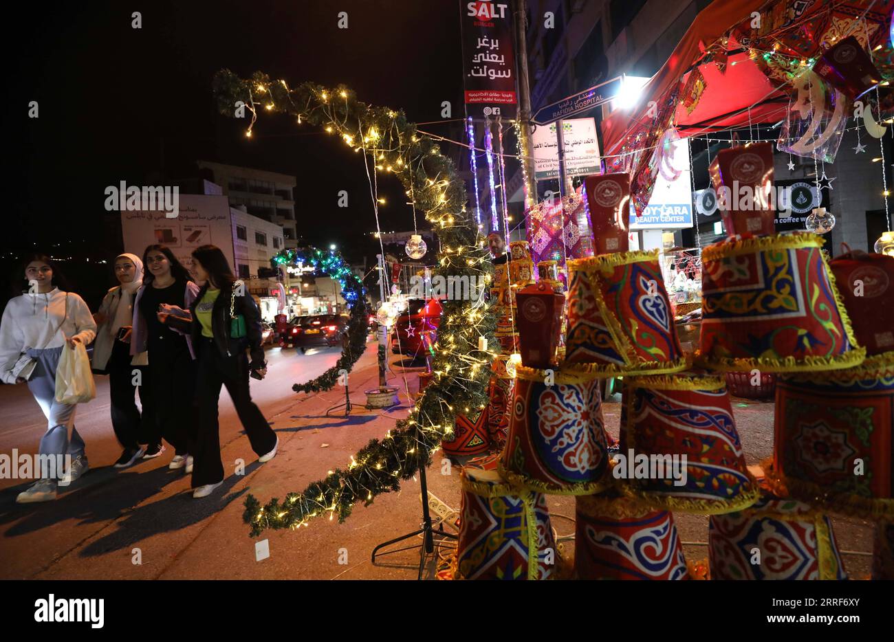 220401 -- NABLUS, April 1, 2022 -- People visit a market ahead of the ...
