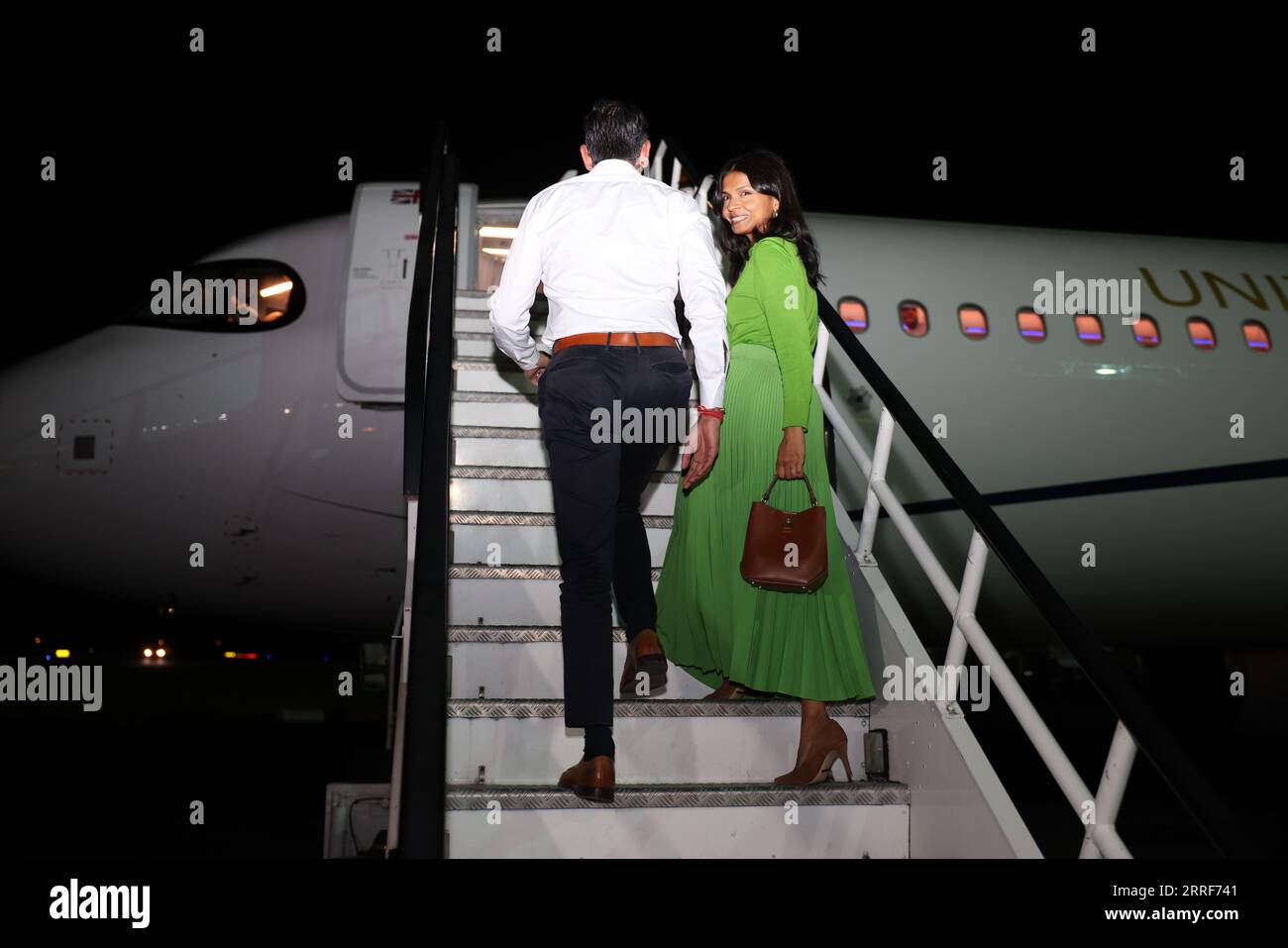 Prime Minister Rishi Sunak and his wife Akshata Murthy board the plane ...