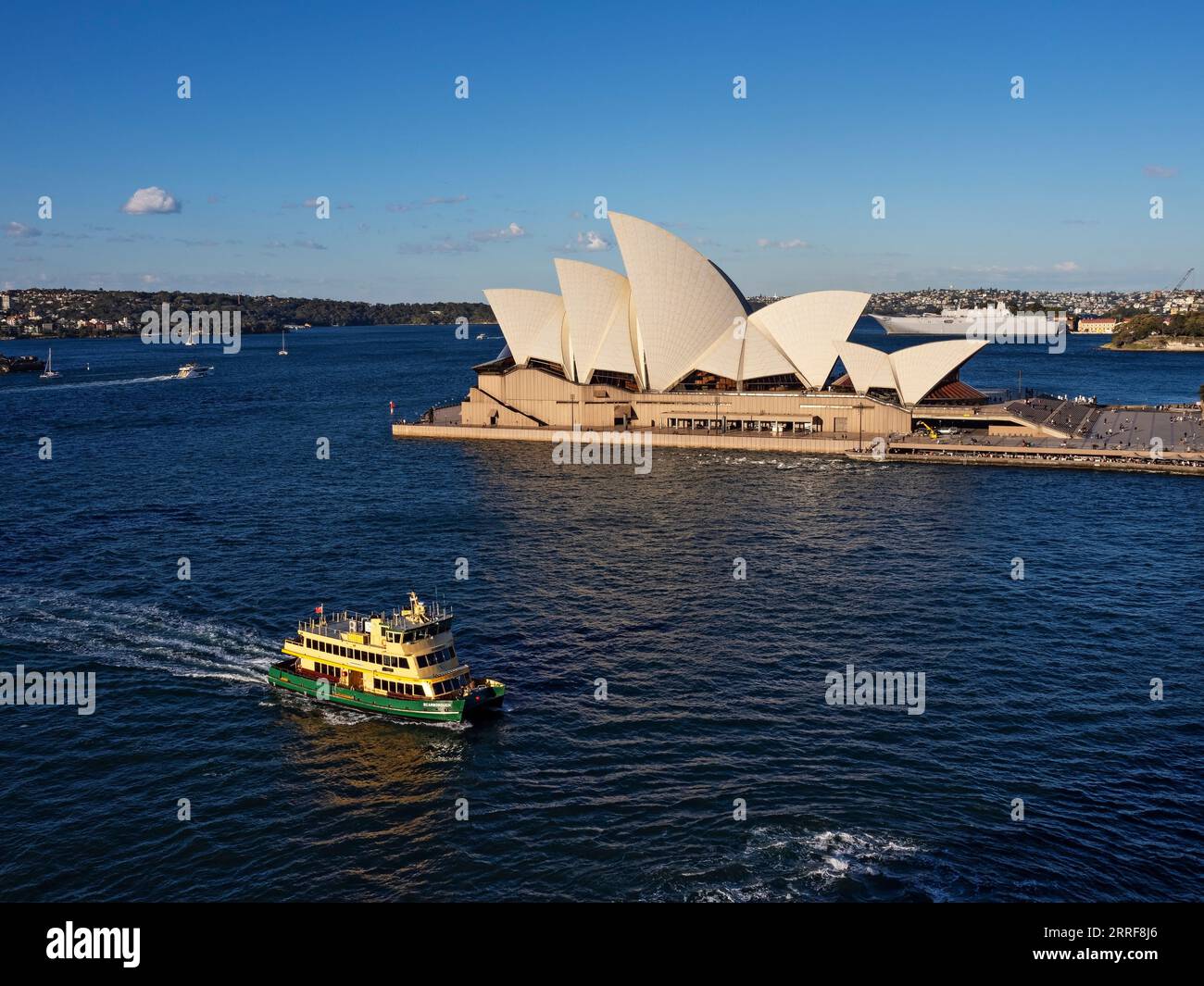 Sydney Australia / A Sydney commuter ferry passes the Sydney Opera ...