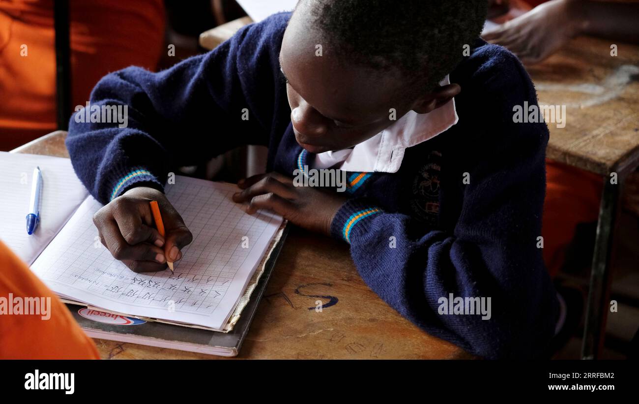 220411 -- WAKISO, April 11, 2022 -- Charles Bwebale writes Chinese ...