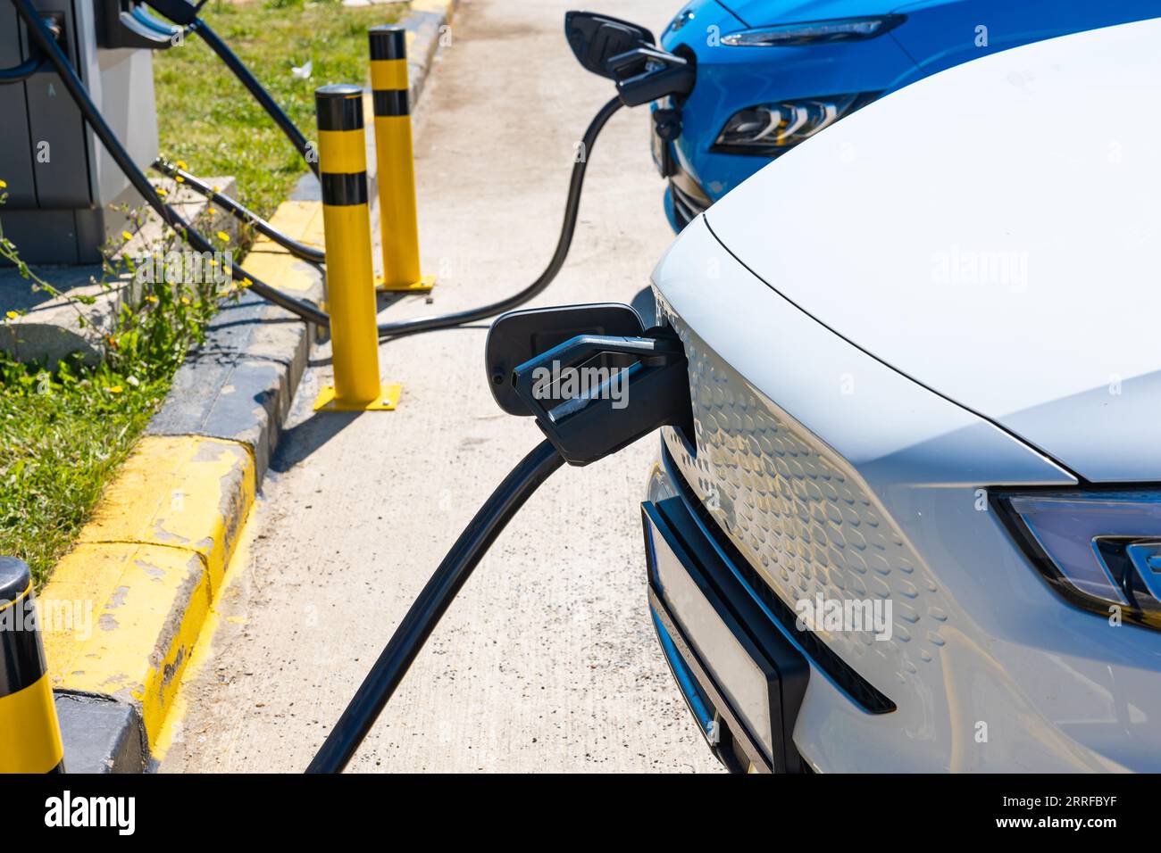 Fast EV charger plugged in an electric car. Sustainablity or future ...
