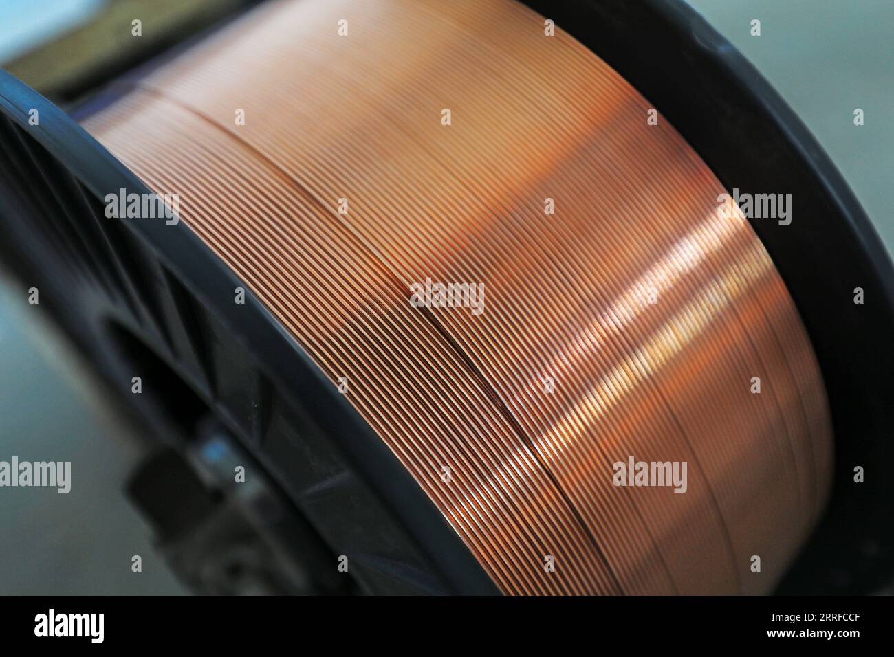 Rolled red copper wire, close-up photo Stock Photo - Alamy