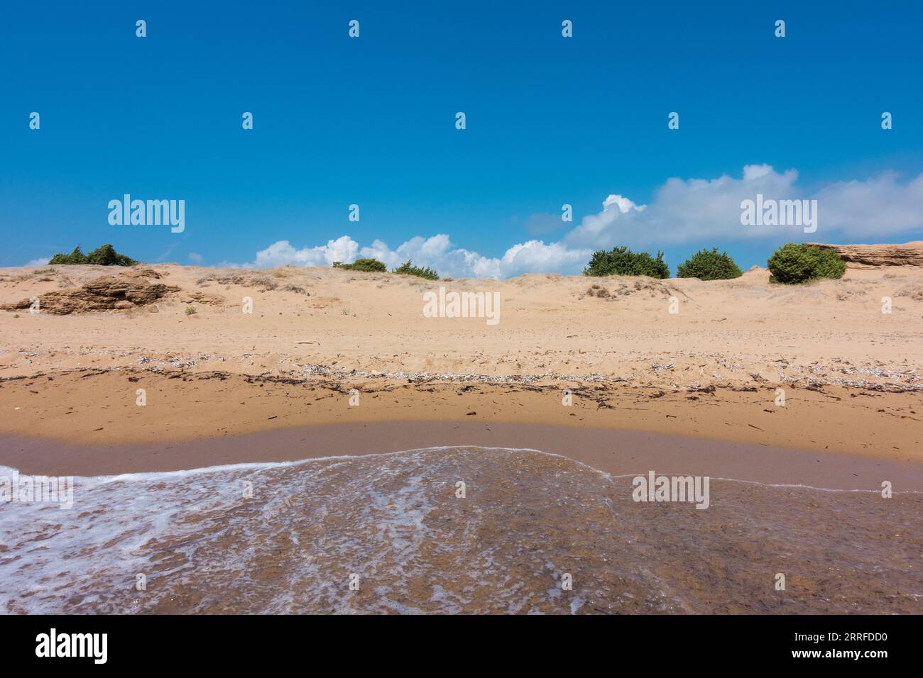 The gorgeous sandy beach of Issos in Corfu island, Greece Stock Photo ...