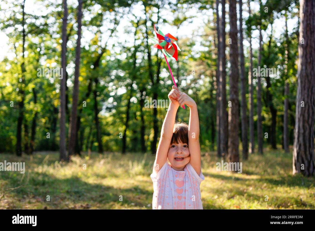 Girl with a pinwheel hi-res stock photography and images - Alamy