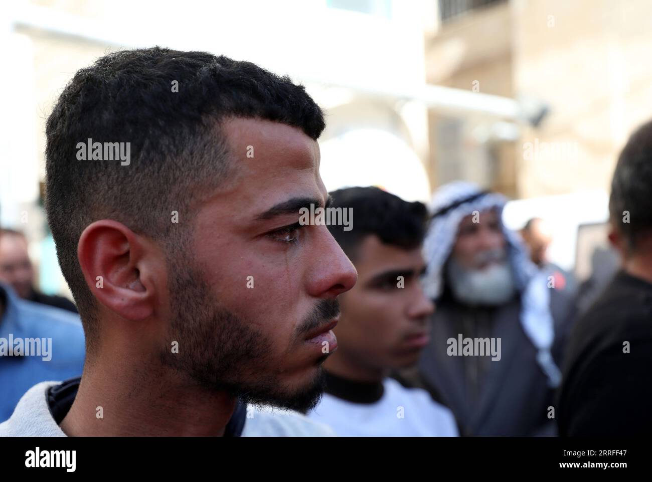 220415 -- JENIN, April 15, 2022 -- A relative mourns during the funeral ...