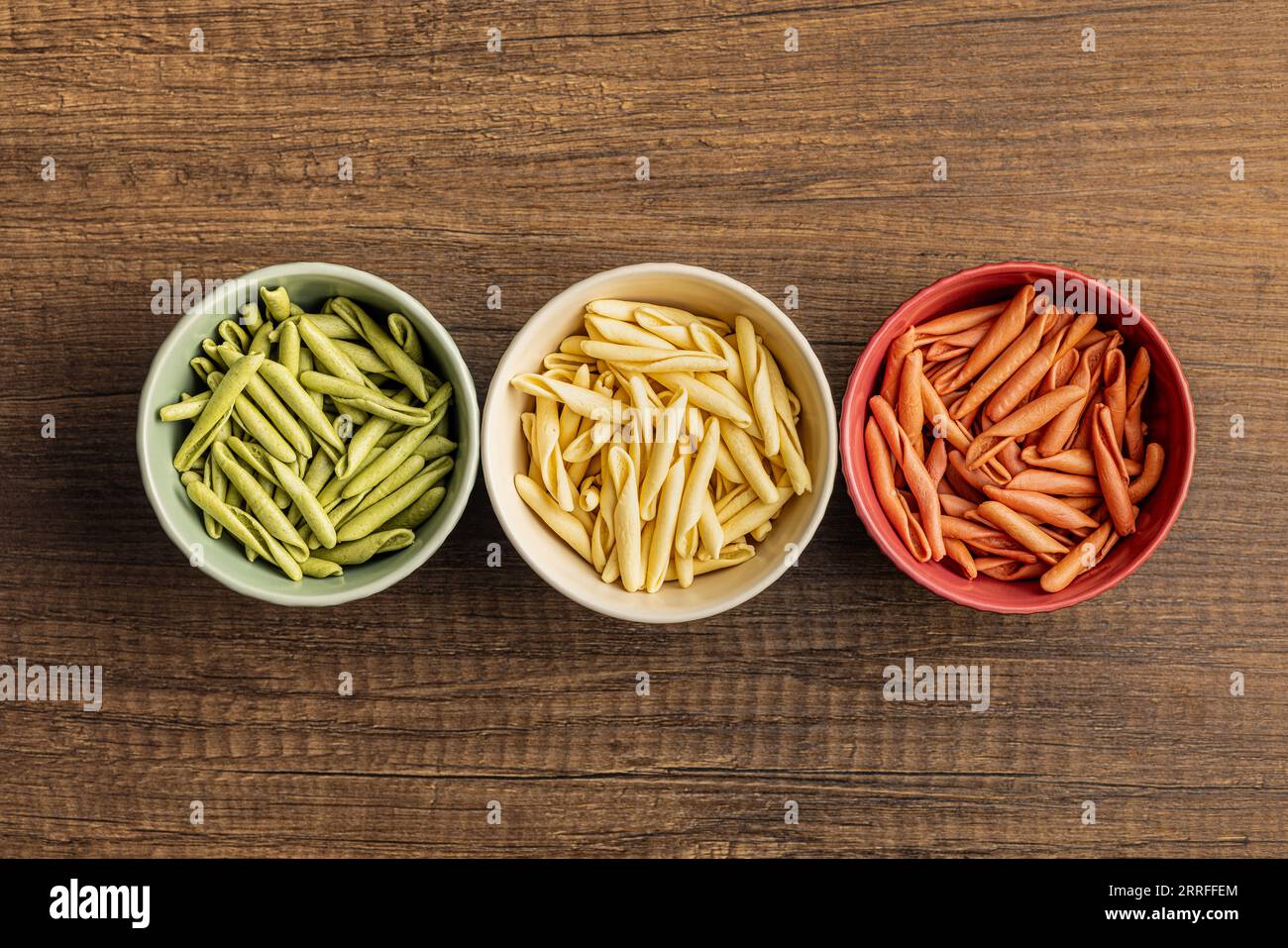Fusilli pugliesi. Italian tricolor twisted pasta in the bowl. Top view ...