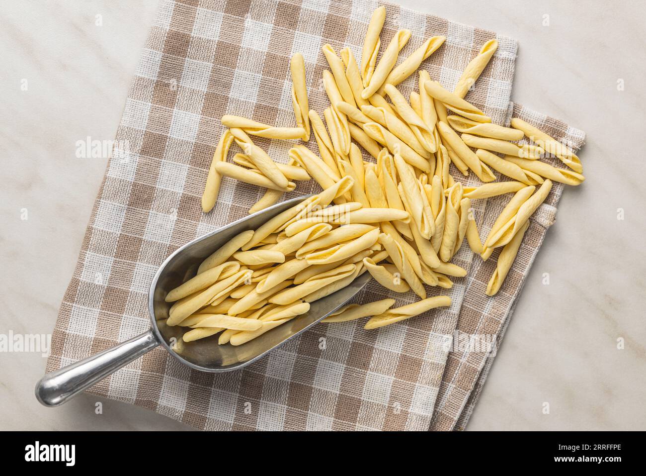 Fusilli pugliesi. Italian twisted pasta in the scoop. Top view Stock ...