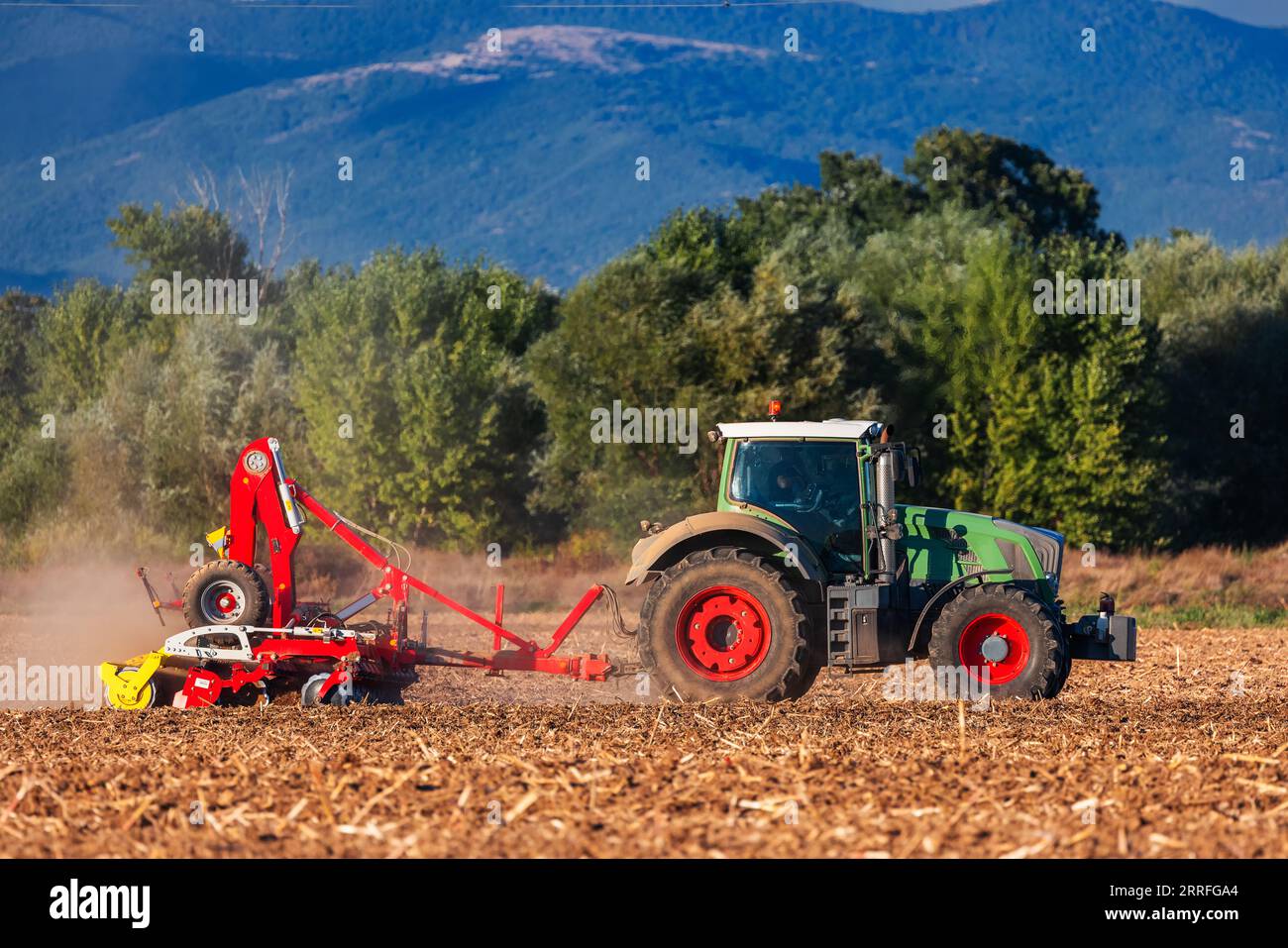 Farmer in tractor preparing land hi-res stock photography and images ...