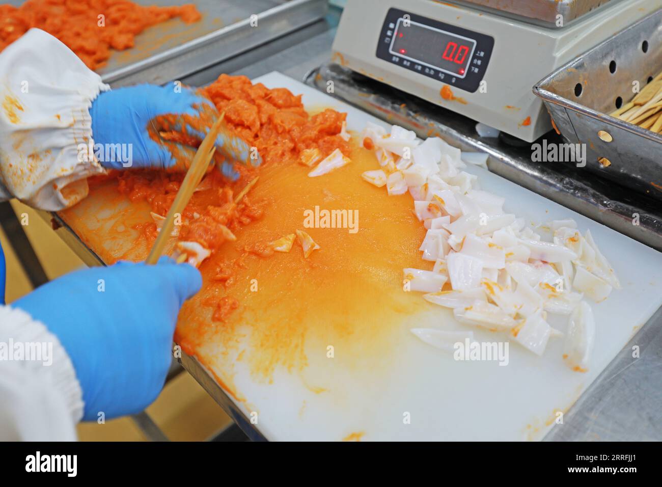 Workers are making chicken products in a food processing plant Stock ...