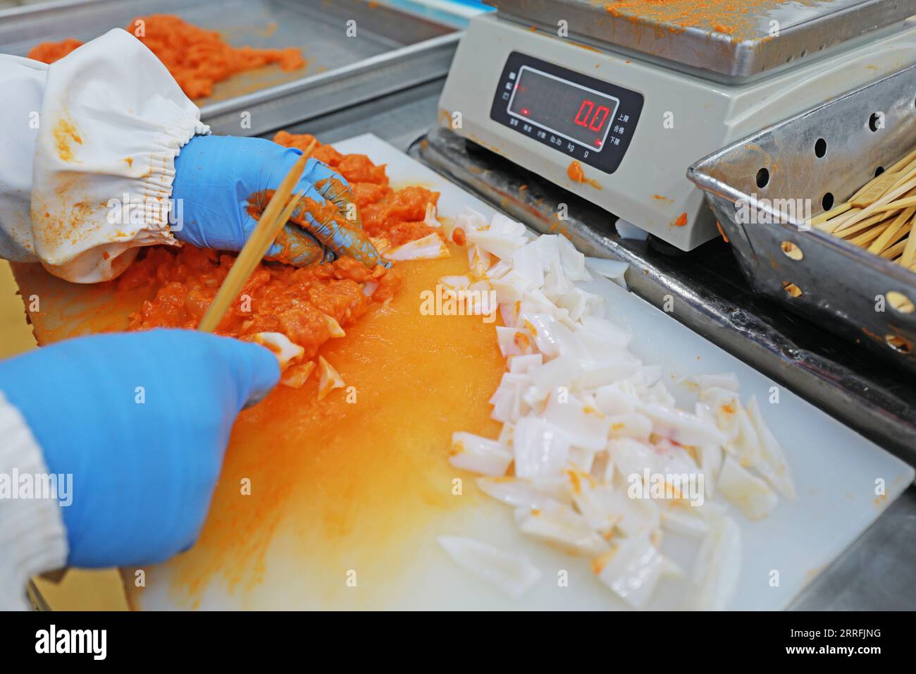 Workers are making chicken products in a food processing plant Stock ...