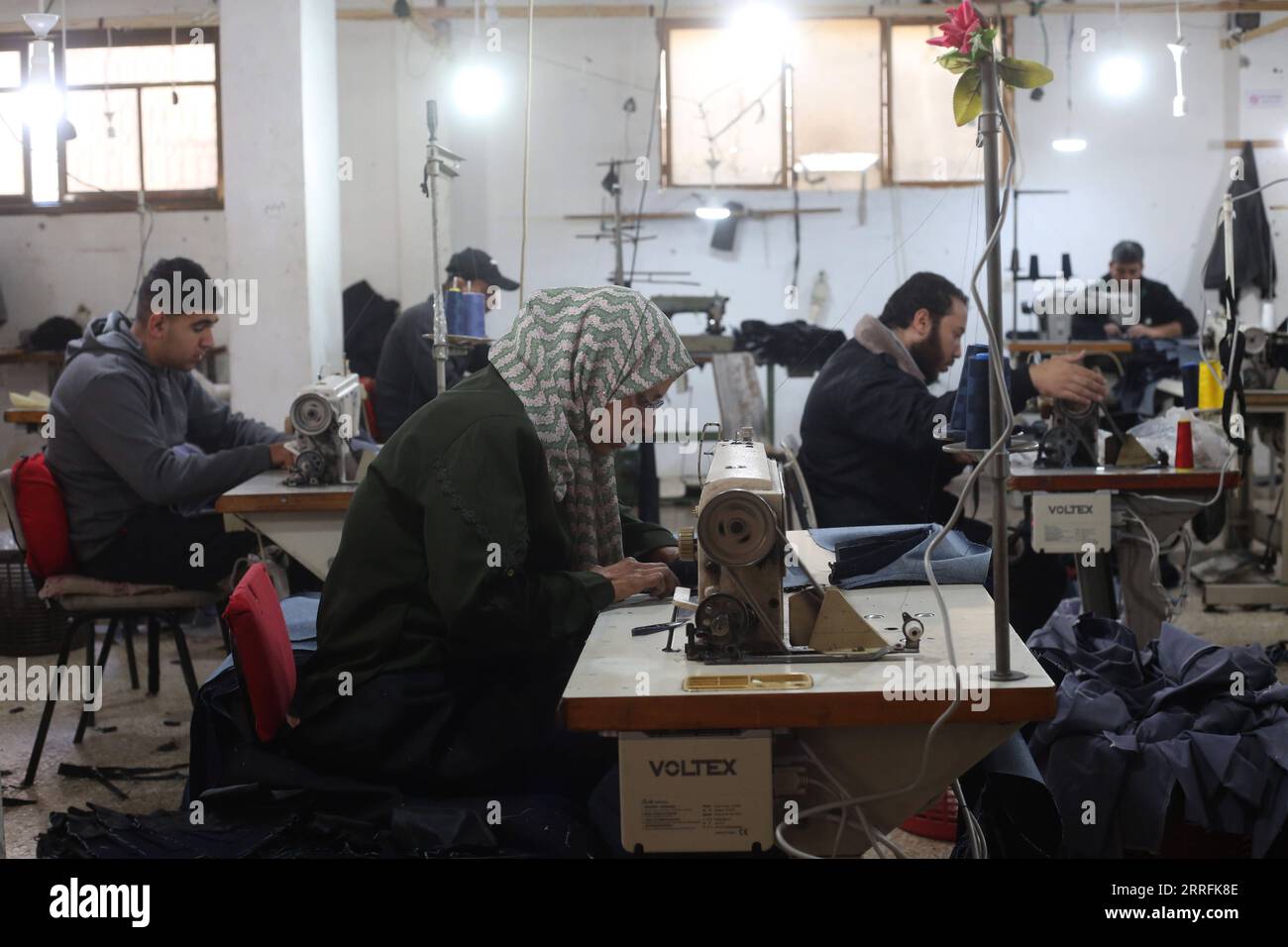 220420 -- RAFAH, April 20, 2022 -- Palestinian tailors make clothes for ...