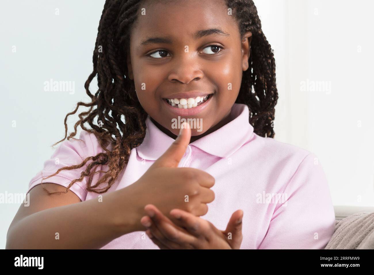 Smiling Young Mother Learning Sign Language To Talk With Her Hearing ...