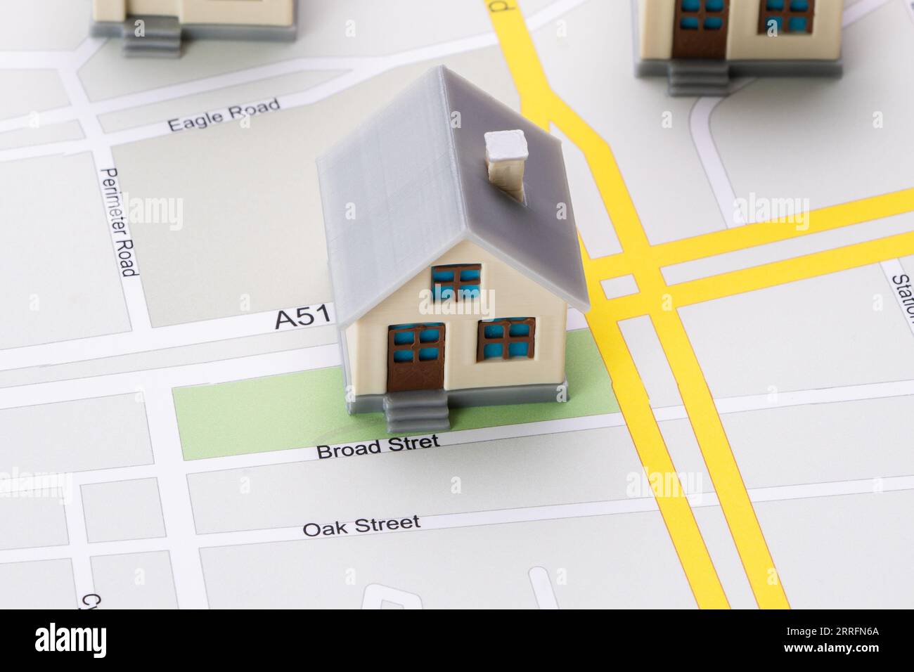 High Angle View Of Small House Models Over Road Route Map Stock Photo ...