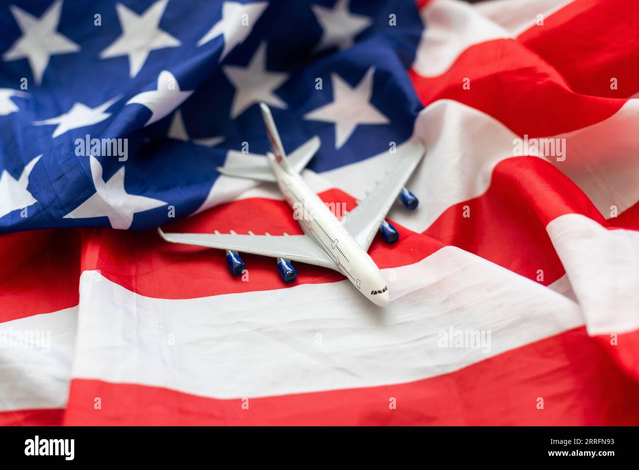United states flight background. Airplane toy on a starts and stripes ...