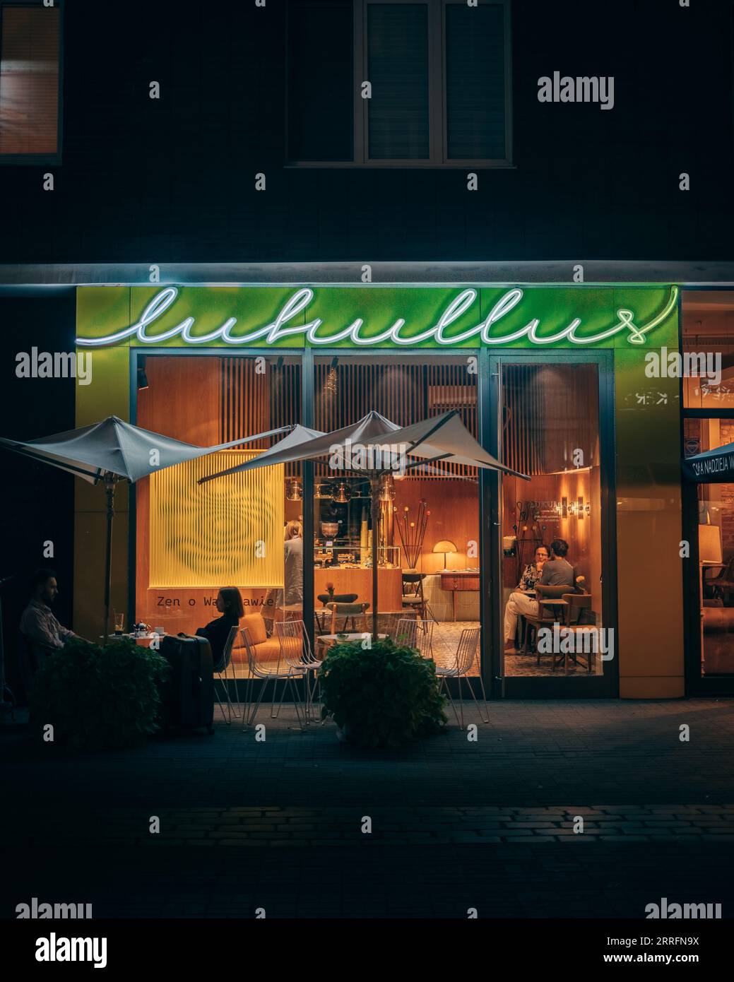 Lukullus neon sign at night in Warsaw, Poland Stock Photo - Alamy