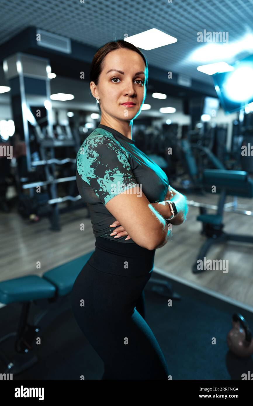 Portrait of a female personal trainer in a gym Stock Photo - Alamy