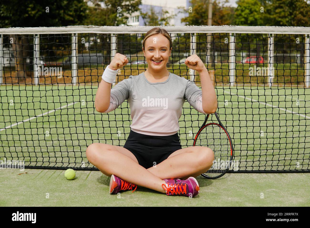 Portrait of young woman professional female tennis player in uniform ...