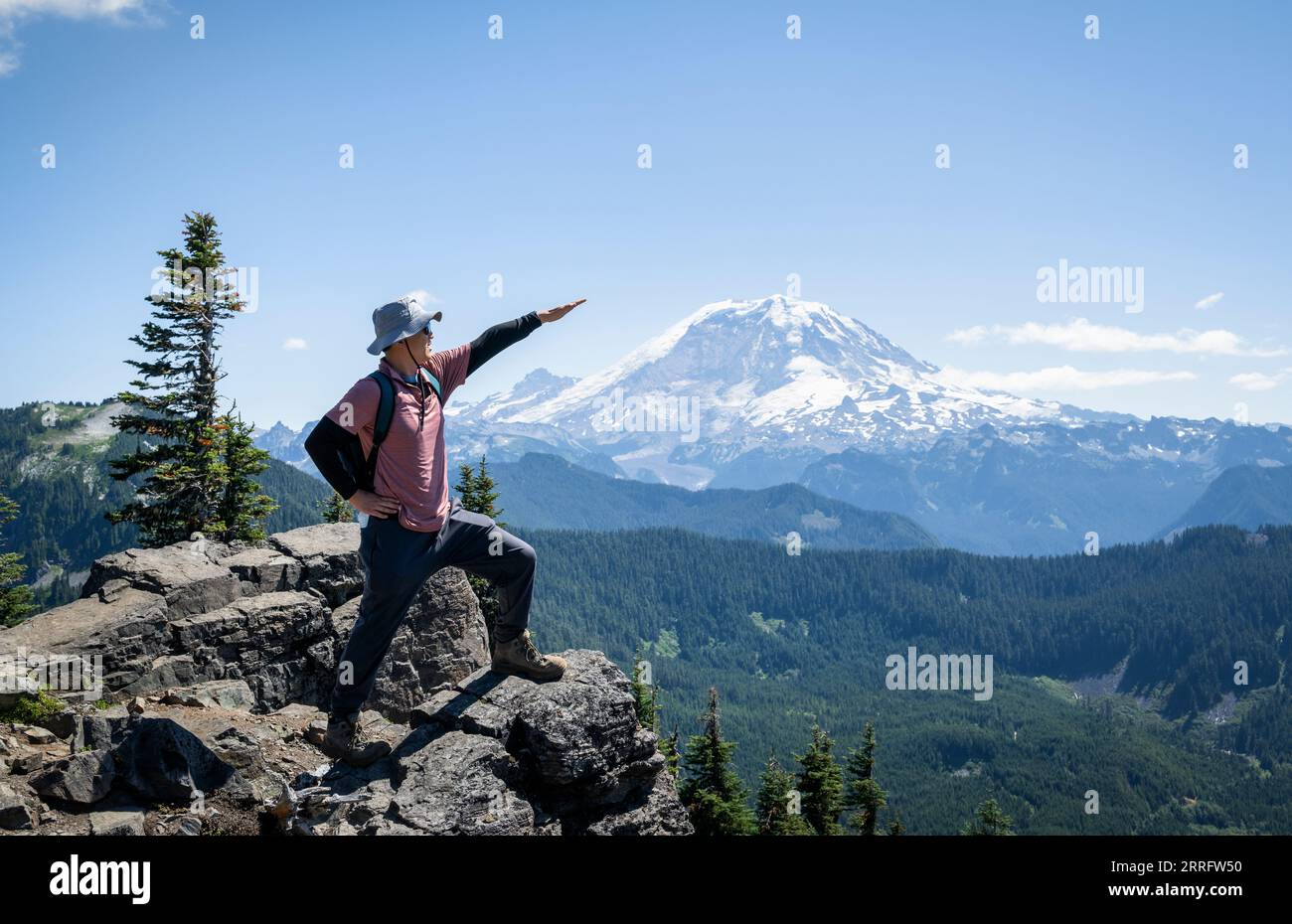 Man raising hand towards Mount Rainier from Summit Lake Trail. Mt ...