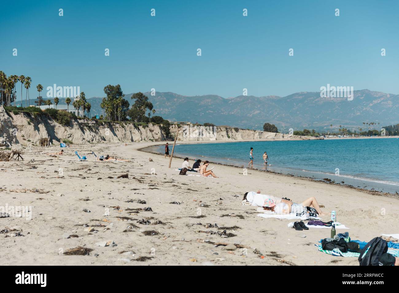 Sunny day beach people sunbathing hi-res stock photography and images ...