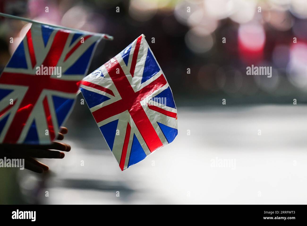 Spectators wave Union Flags in support of the Tour of Britain 2023 ...
