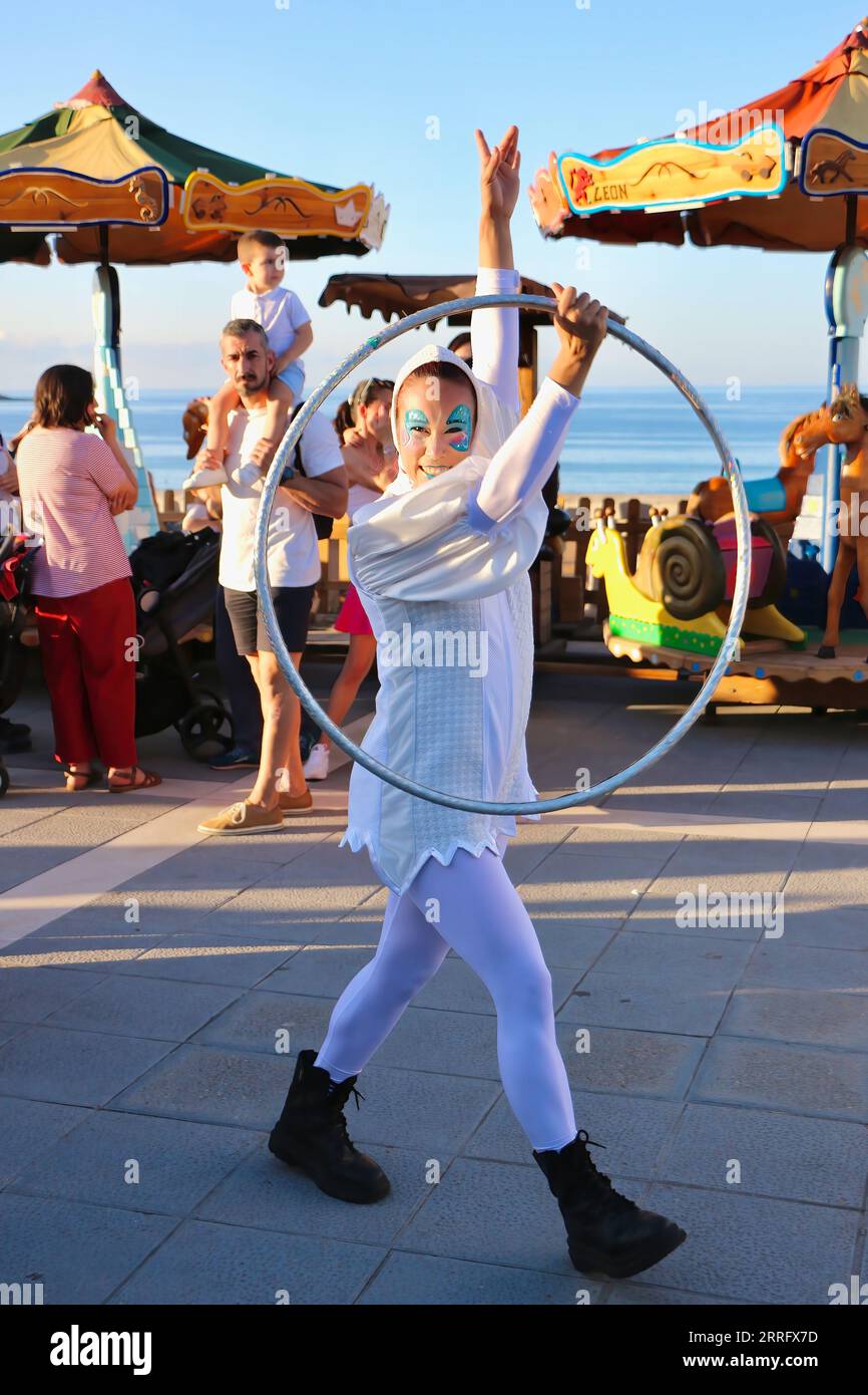 Bambolea circus performers public event on stilts and a girl with a ...