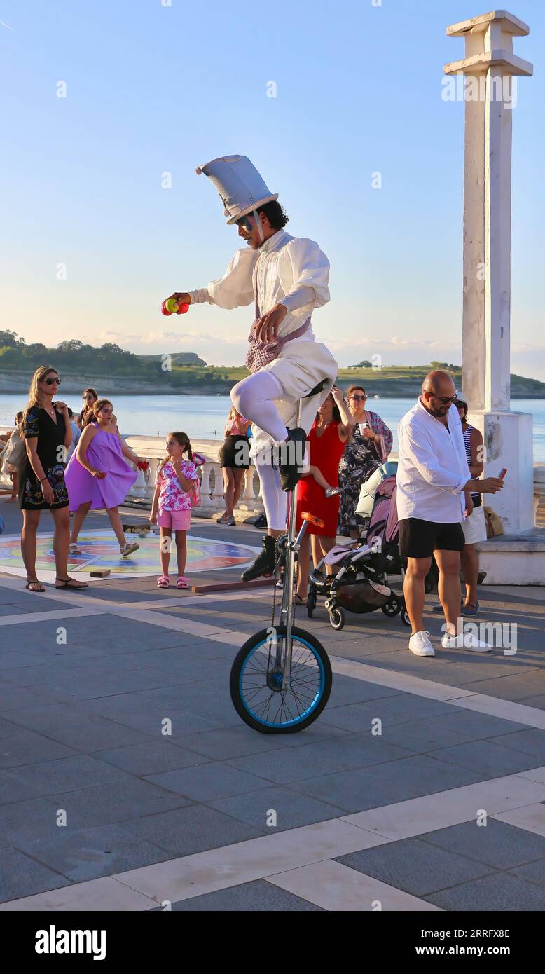 Bambolea circus performer on a high unicycle public event on stilts and ...