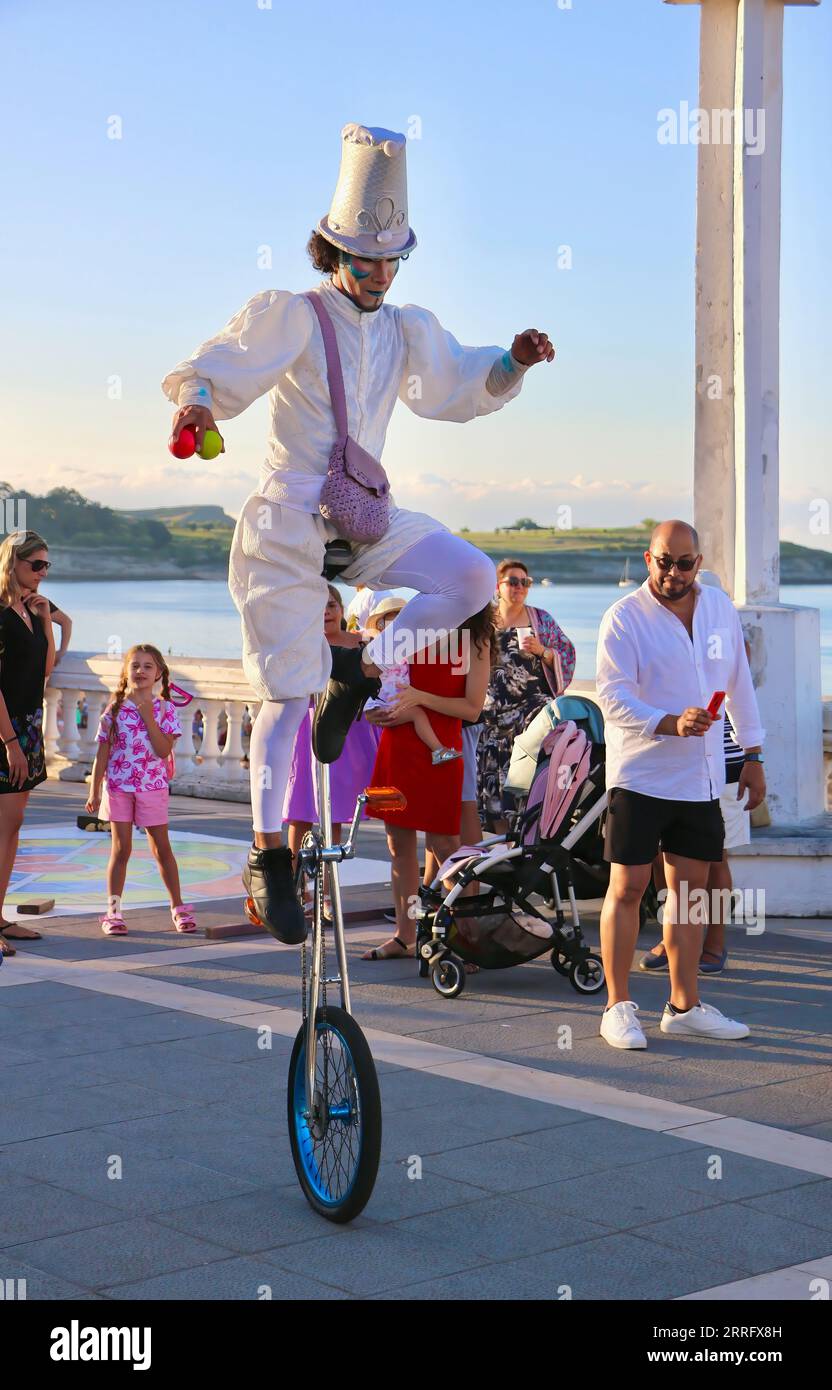 Bambolea circus performer on a high unicycle public event on stilts and ...