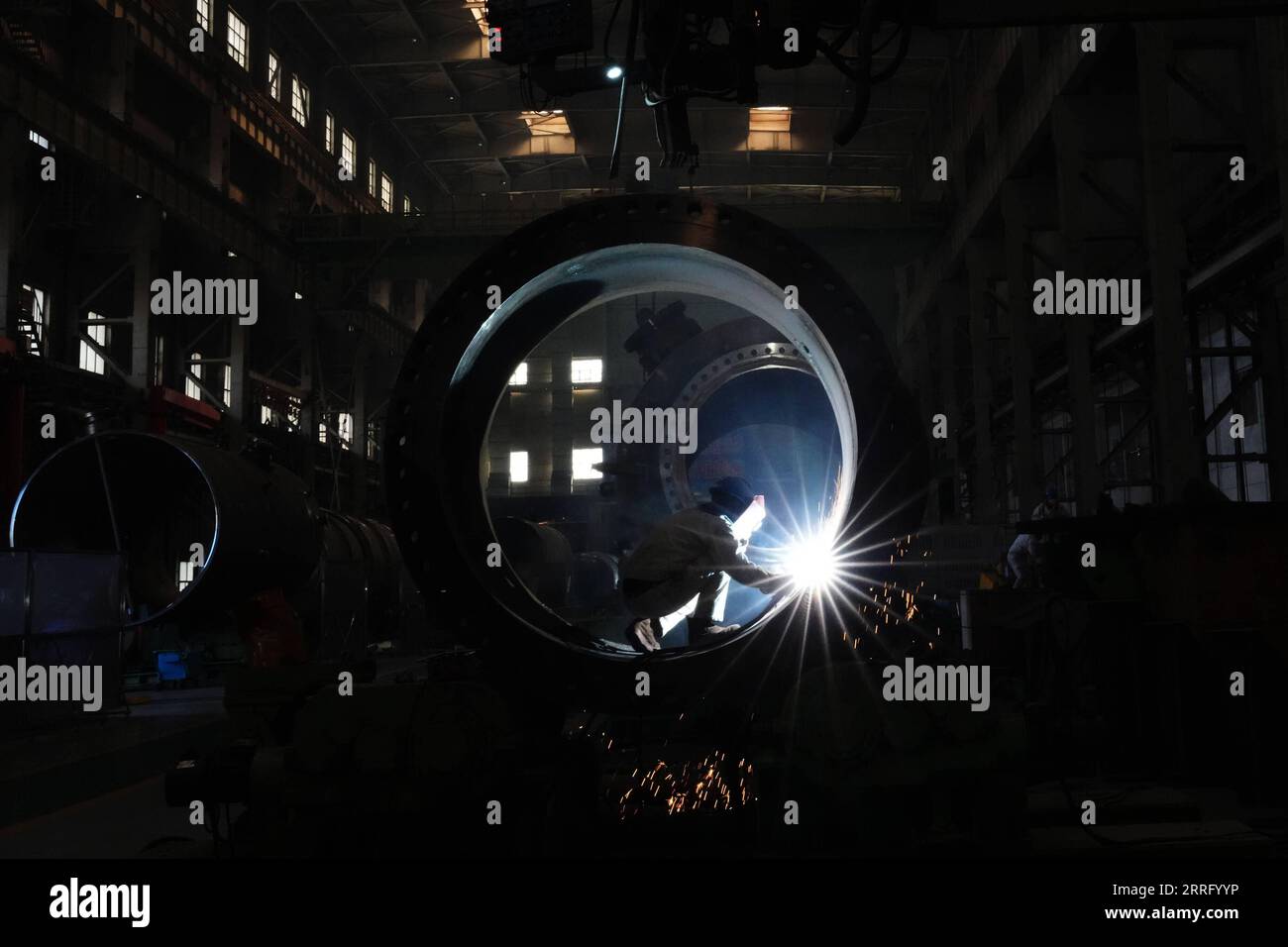 220501 -- HARBIN, May 1, 2022 -- A worker works at Harbin Boiler ...