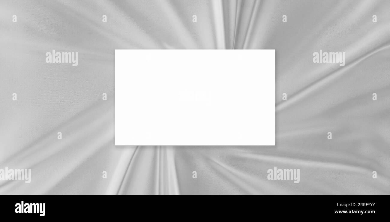 White blank paper card on grey silky fabric cloth. Design for blog with ...
