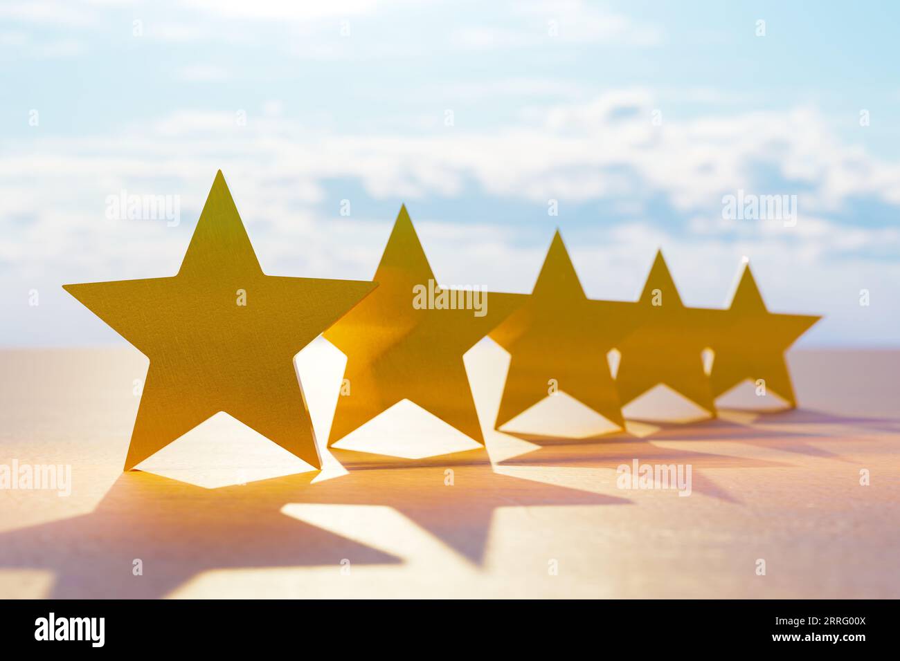 Five Glossy yellow and gold stars. 5 golden star Rating Review. Customer rating feedback concept ...