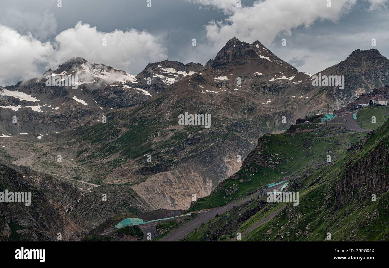 gloomy atmospheric rocks, dark mountains covered with clouds and puffs ...