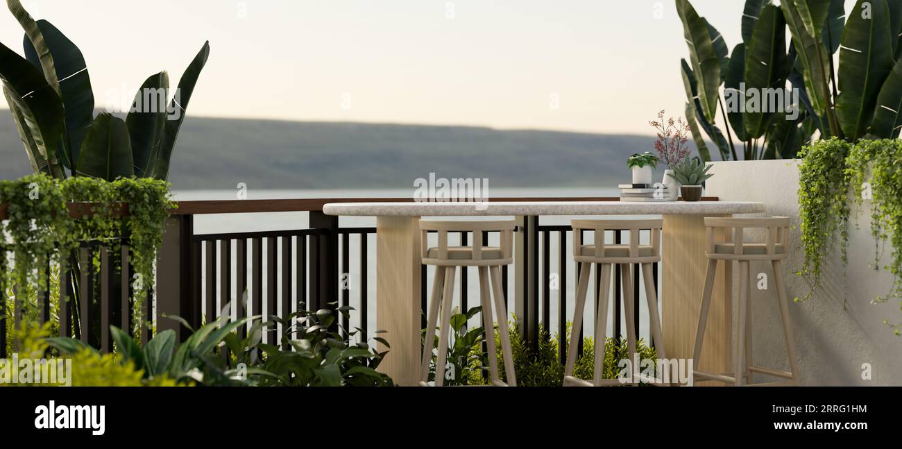 A beautiful outdoor relaxation space on a balcony with green tropical ...