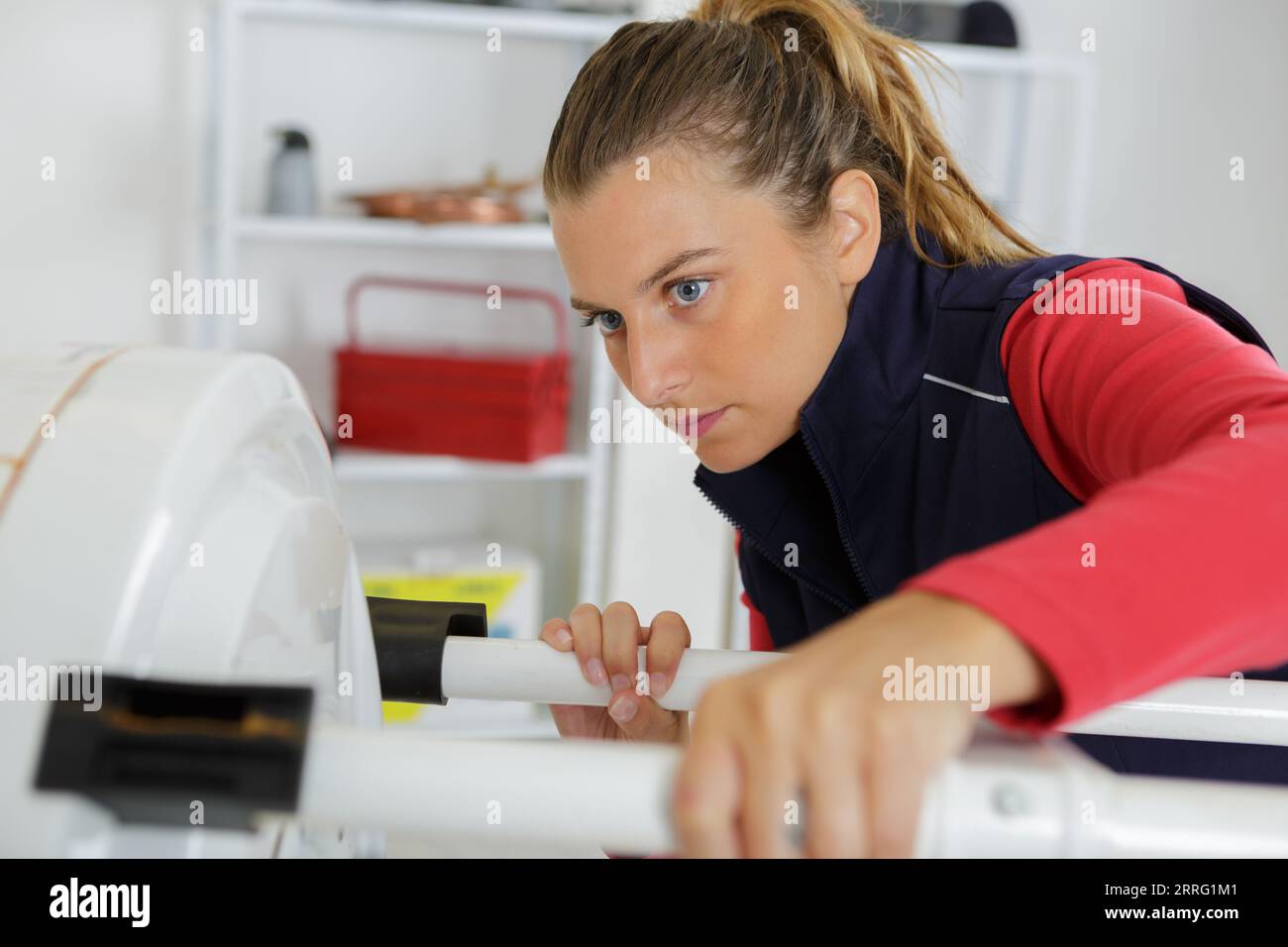 Female water heater technician hi-res stock photography and images - Alamy